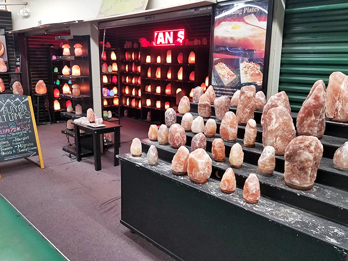 The Himalayan salt lamp display glows with the promise of better air quality and the certainty of becoming your next impulse purchase.