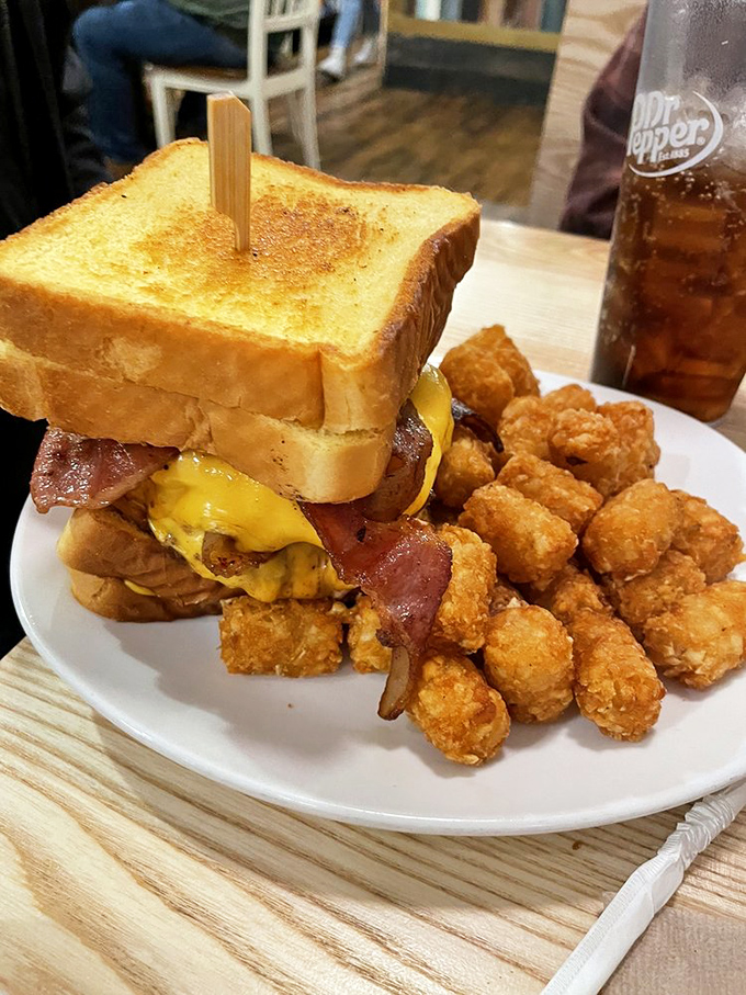 Simplicity elevated to art form: melted cheese, fresh vegetables, and a perfectly toasted bun. This burger understands the power of restraint.