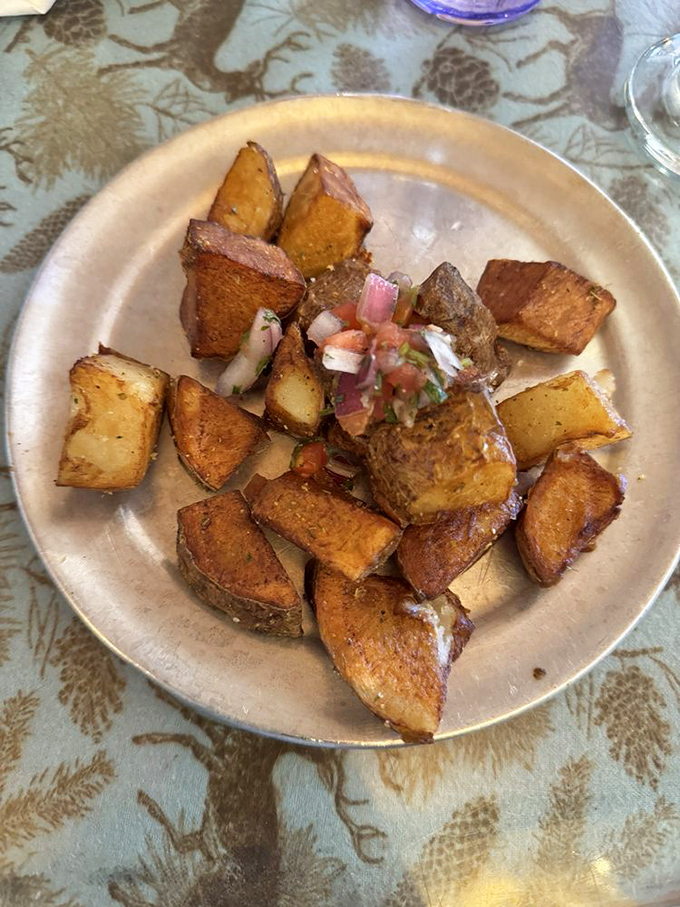 These aren't just home fries; they're potato cubes that went to culinary finishing school, topped with fresh pico that adds zip to every bite.