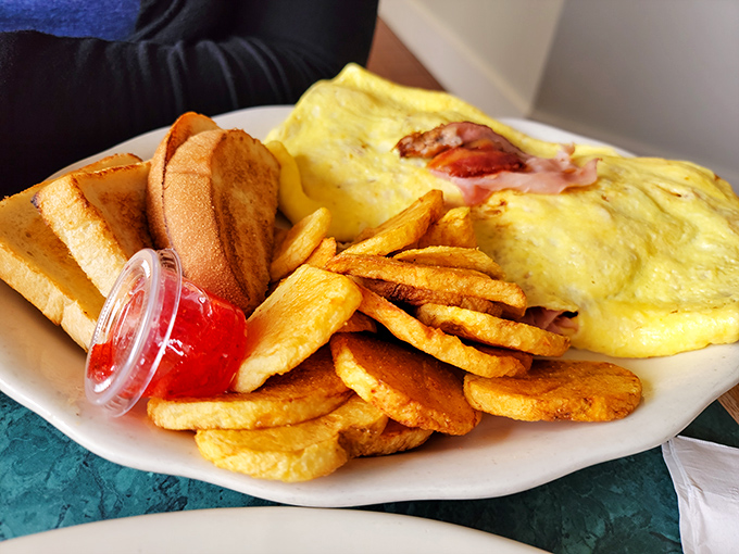 Breakfast of champions! This fluffy omelet with home fries could power you through farm chores or, more realistically, an afternoon of antiquing.