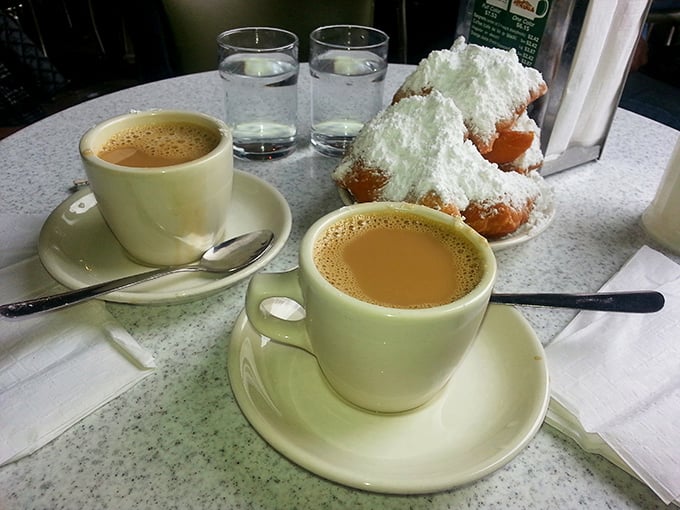The classic pairing that's outlasted most Hollywood marriages. Hot chicory coffee cuts through sweet beignet indulgence like a well-written punchline after perfect setup.