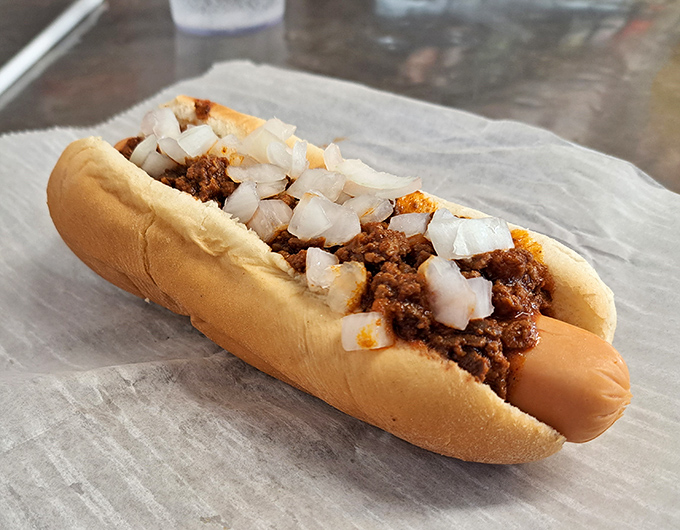 This isn't just a chili dog&mdash;it's a masterclass in the art of comfort food, where diced onions add the perfect crunch to that legendary spiced meat sauce.