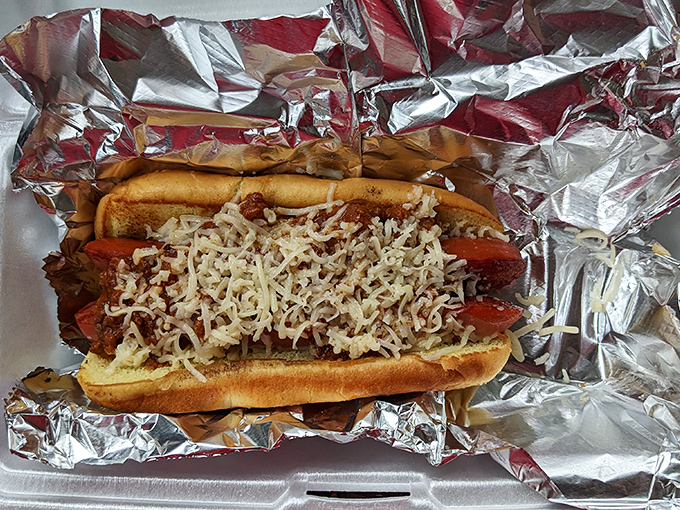 This isn't just a hot dog &ndash; it's a masterclass in toppings architecture, where cheese and chili create a beautiful, messy symphony.