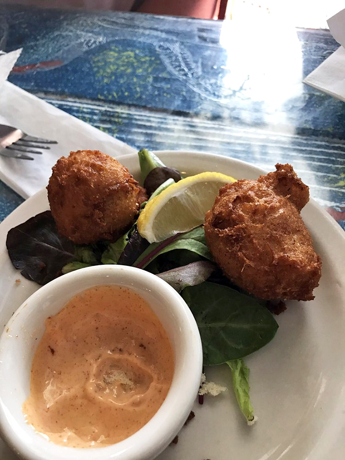 Golden-brown crab cakes that crunch like autumn leaves, paired with a sauce that would make even the most sophisticated palate do a happy dance. 