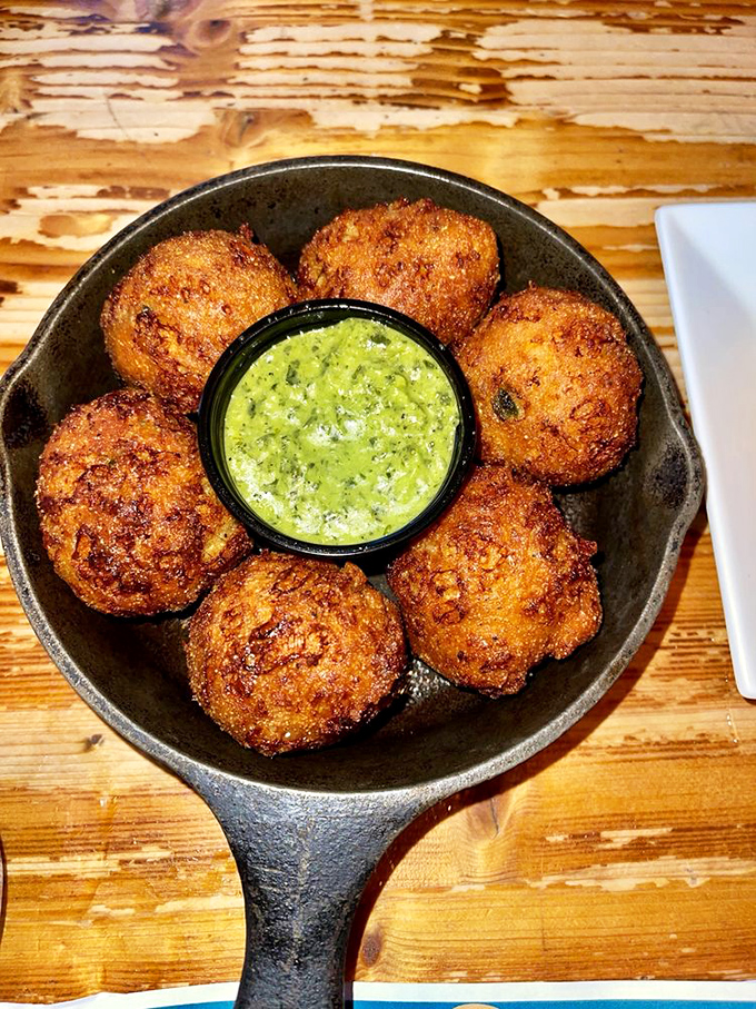 Hush puppies that demand you make some noise about how good they are. These golden orbs of cornmeal joy surround a vibrant dipping sauce.