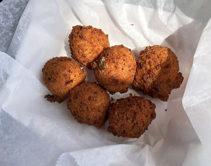 Hush puppies so perfectly golden they should be in a museum. Until they should be in your mouth.