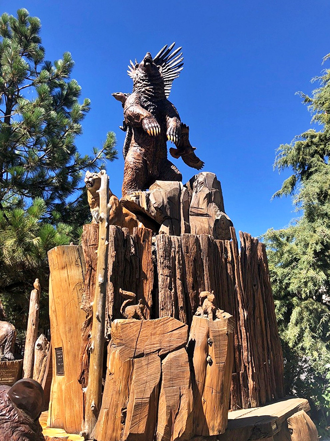 This magnificent wooden sculpture stands as proof that chainsaws can create art that belongs in museums, not just horror movies.