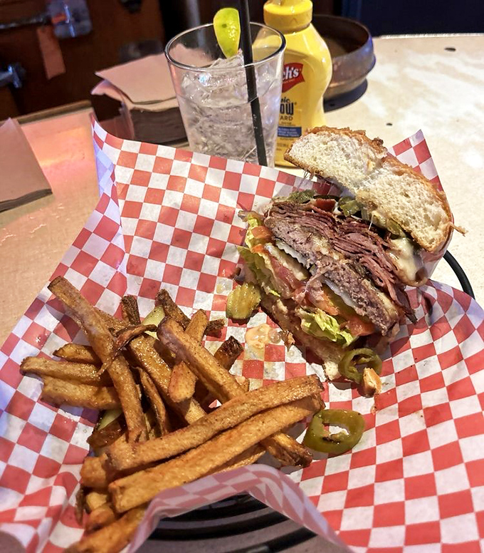 Not just breakfast! This towering sandwich with golden fries proves Mock Crest knows its way around lunch too &ndash; comfort food elevated.