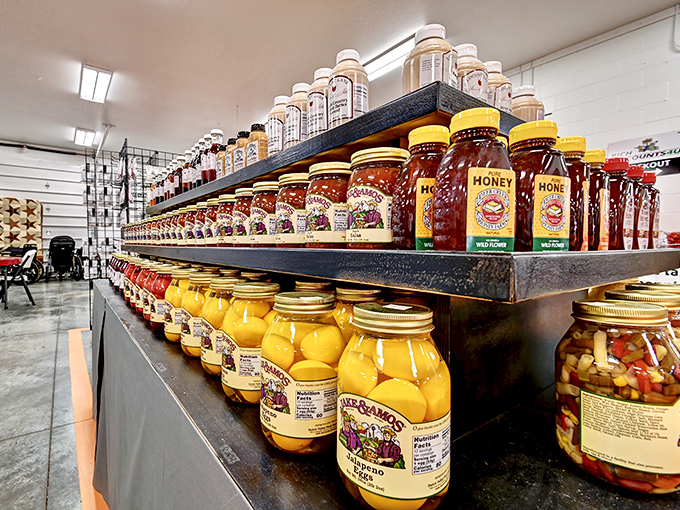 Jars of golden honey and vibrant preserves line up like edible jewels, each containing summer sunshine you can spread on toast.