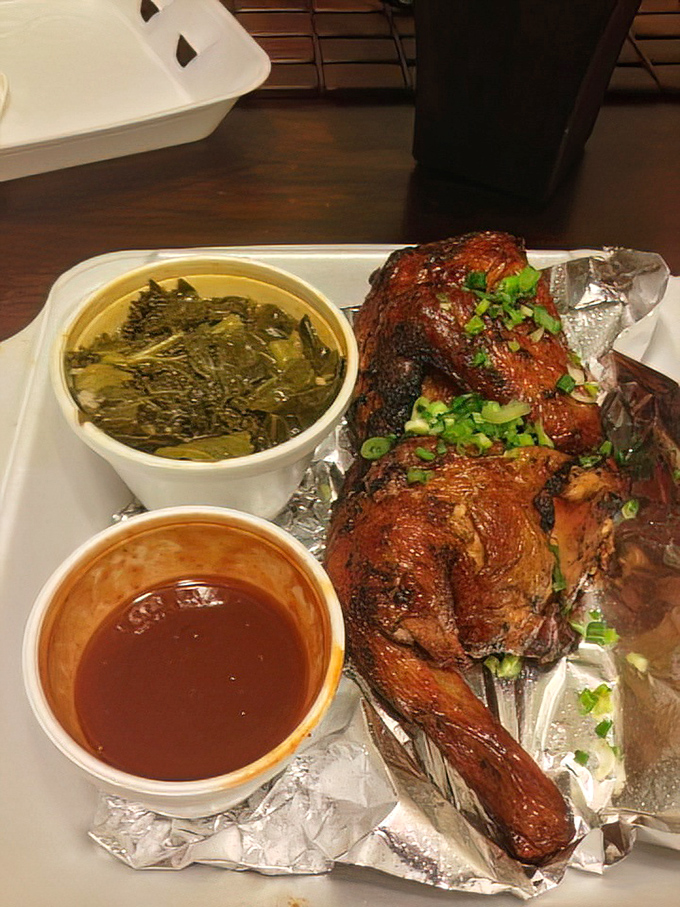 Jerk chicken that would make Jamaica proud, nestled beside greens that have clearly been taking their sweet time getting acquainted with flavor.