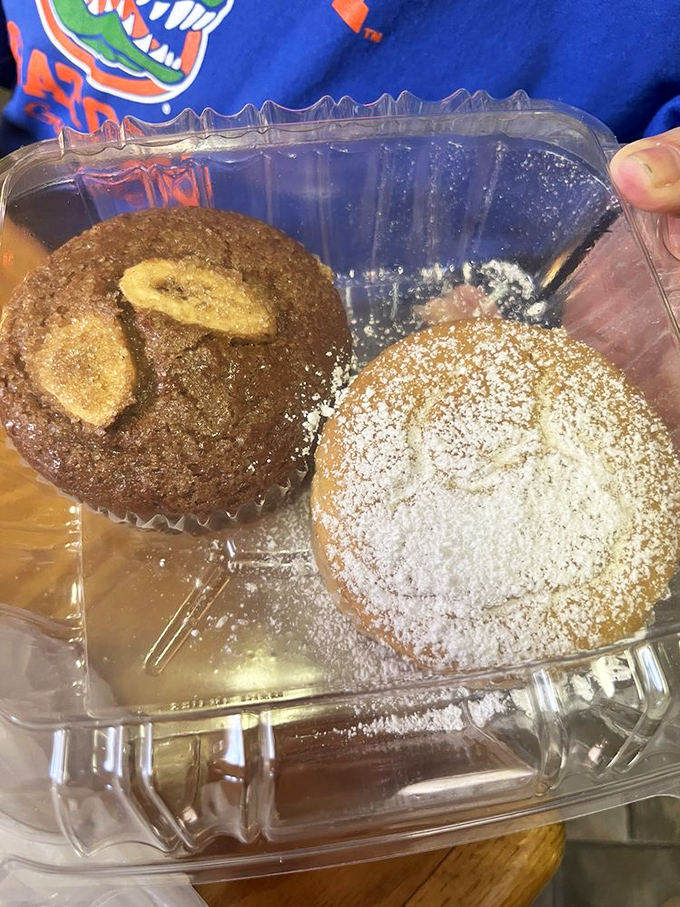 These muffins aren't just baked goods &ndash; they're edible souvenirs. One banana-topped beauty and one powdered masterpiece ready for their close-up.