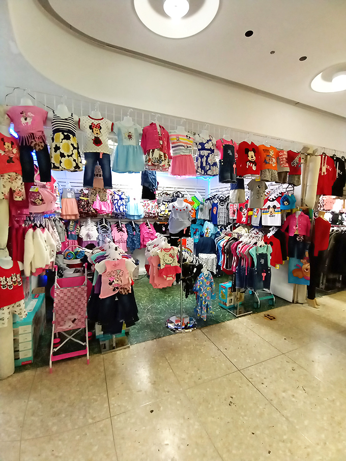 Colorful children's clothing transforms this corner into a rainbow of possibilities for growing little ones everywhere.
