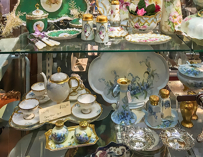 Delicate teacups and saucers with forget-me-not patterns wait patiently for their next afternoon tea, having already served generations of pinky-raisers.