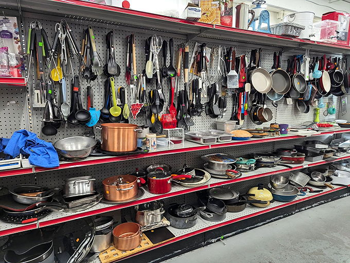 Kitchen utensil nirvana! Every gadget known to home cooks hangs in perfect order, waiting to whip up memories in a new kitchen.