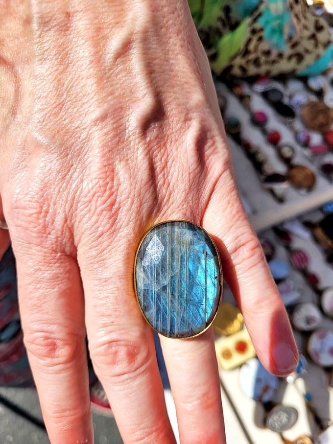 A flash of blue labradorite catches the light like the ocean at sunset. Nature's artistry captured in a single statement ring.