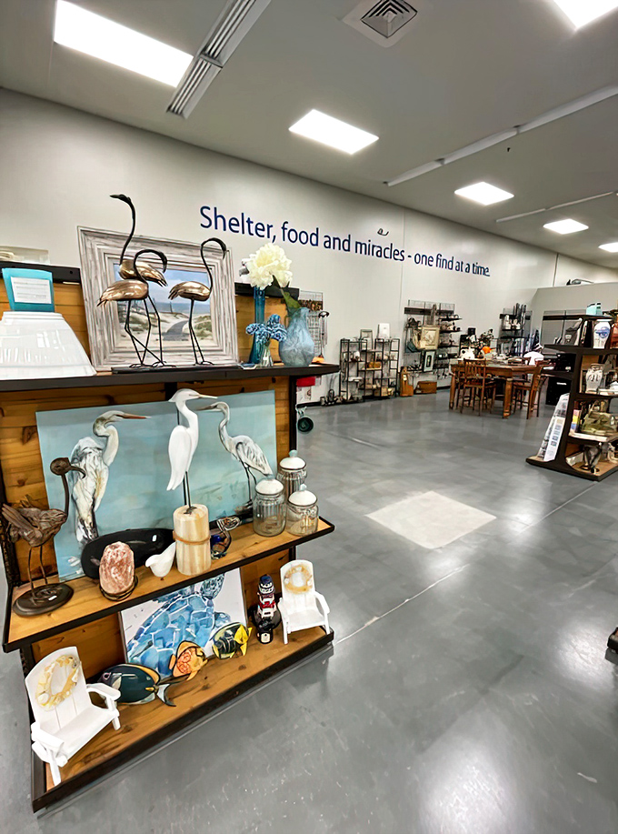 "Shelter, food and miracles" adorns the wall above coastal-themed d&eacute;cor, reminding shoppers their purchases support community programs.