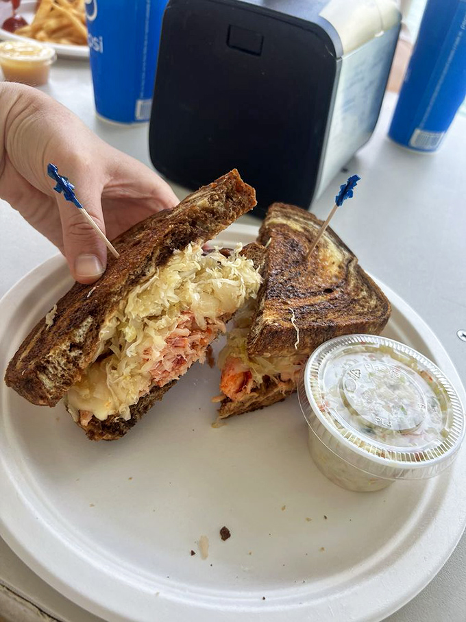 The legendary Lobster Reuben—where New York deli meets Keys seafood. This sandwich has converted more non-seafood eaters than a maritime revival.