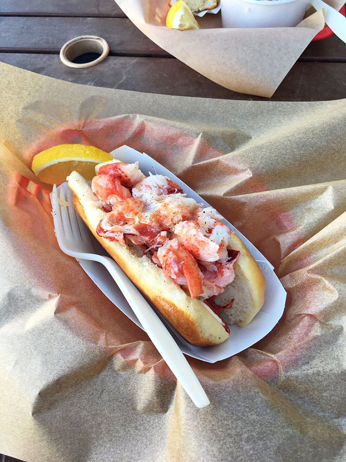 The classic lobster roll in all its glory&mdash;sweet meat, buttery roll, and that essential squeeze of lemon. Some relationships are complicated; this one is deliciously straightforward.
