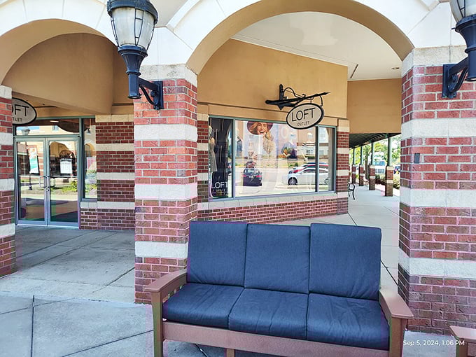 LOFT's inviting storefront offers both fashion finds and a moment of respite on that blue bench when your shopping stamina begins to waver.