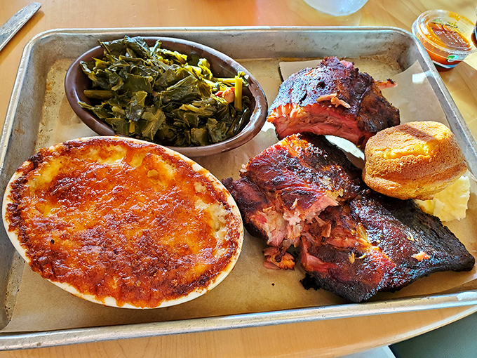 The holy trinity of comfort: mac and cheese with a perfectly caramelized top, fall-off-the-bone ribs, and collard greens that might make a Southerner weep with joy.
