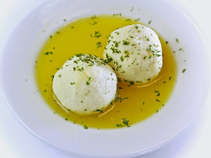 These matzo balls float like clouds in golden broth&mdash;the Jewish penicillin that could cure everything from colds to existential crises.