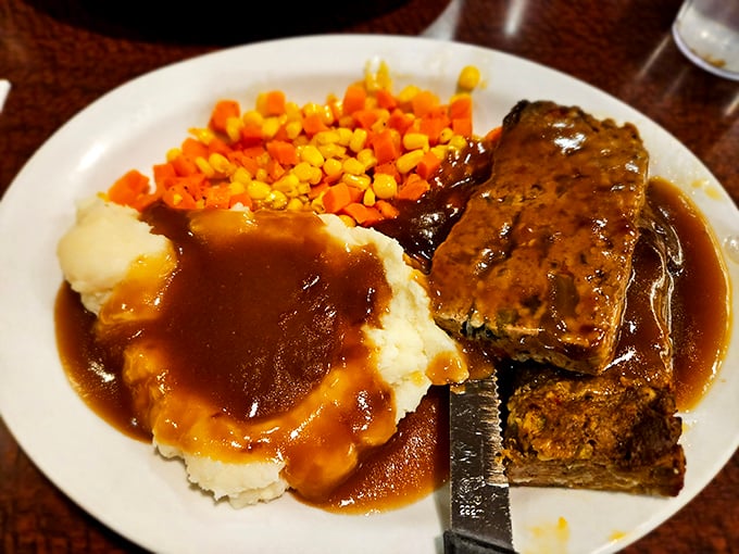 This isn't just meatloaf &ndash; it's edible nostalgia served on white plates, where every bite tastes like someone's grandmother is in the kitchen.