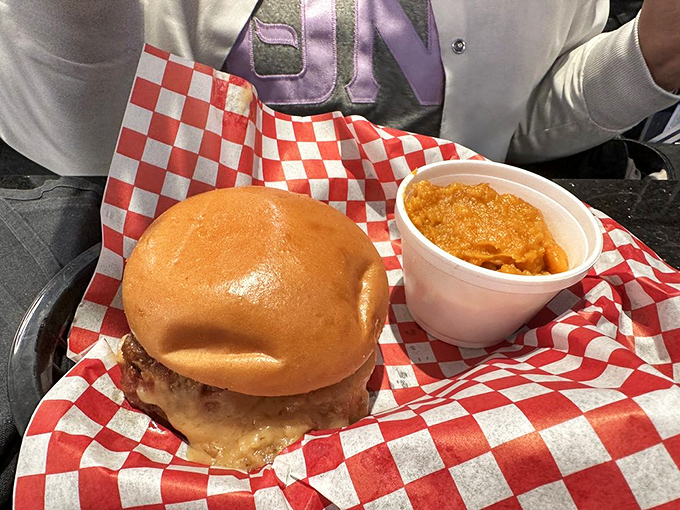 The humble burger, elevated to art form – nestled on a perfectly toasted bun with a side of sweet potato mash that might make you forget about regular potatoes entirely.