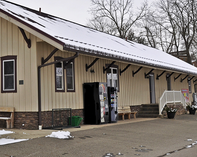 Winter's touch adds a quiet dignity to this simple depot building. In small towns, even the most utilitarian structures carry a certain unpretentious grace.
