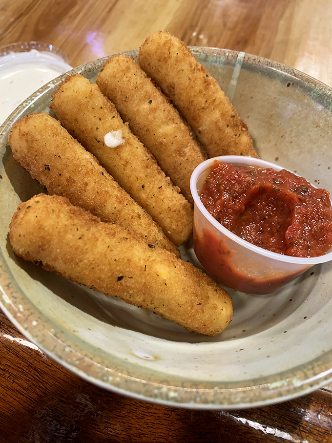 Mozzarella sticks done right &ndash; crispy exterior giving way to that perfect cheese pull that deserves its own slow-motion sequence in a food documentary.