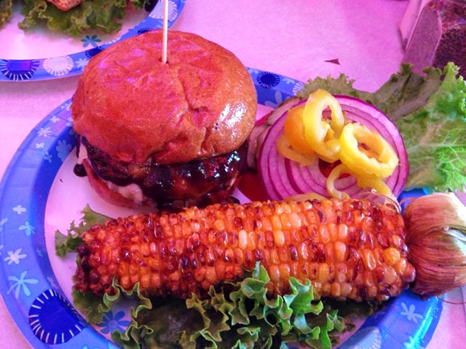 A burger and corn on the cob that could make a vegetarian question their life choices. The colors alone are worth the trip.