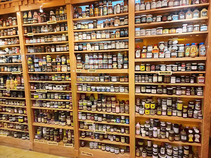 Each shelf represents a different state or country, creating a United Nations of condiments where every jar tells a different culinary story.