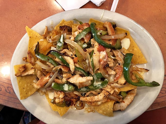 Fajita nachos: where sizzling strips of meat and grilled veggies find their true purpose atop a bed of chips and melted cheese. Life-changing? Possibly.