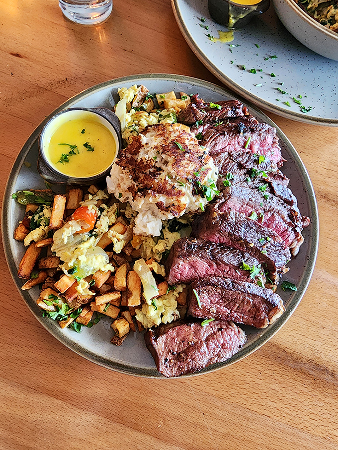 Sliced New York Strip cooked to that magical sweet spot between rare and medium-rare, sharing the plate with colorful companions.