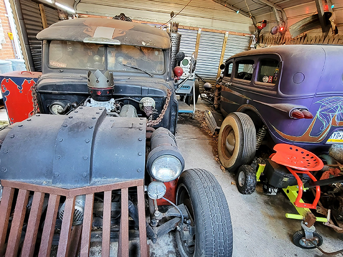 Rust never sleeps at Trundle Manor, where vintage automobiles rest in mechanical purgatory, dreaming of roads long since traveled.