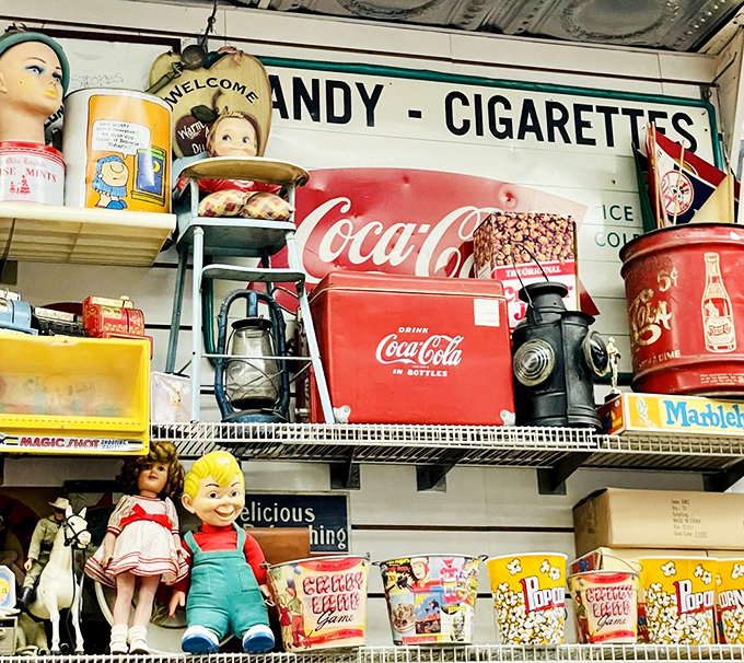 Vintage Coca-Cola memorabilia and retro toys share shelf space with classic candies, a museum of Americana where nostalgia is the main exhibit.