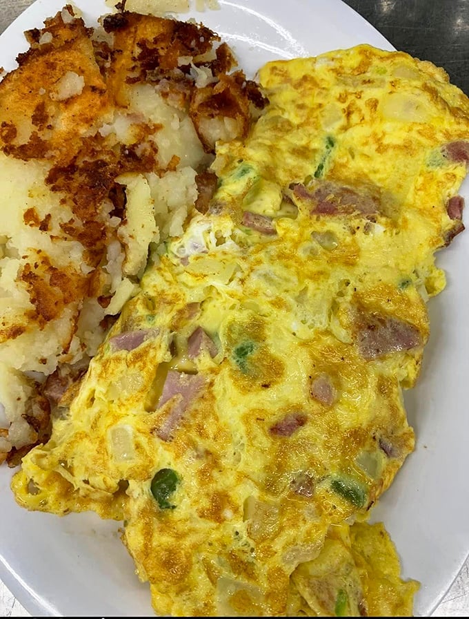 This isn't just an omelet &ndash; it's a masterclass in egg architecture, with perfectly distributed fillings and that golden exterior that haunts your breakfast dreams. 