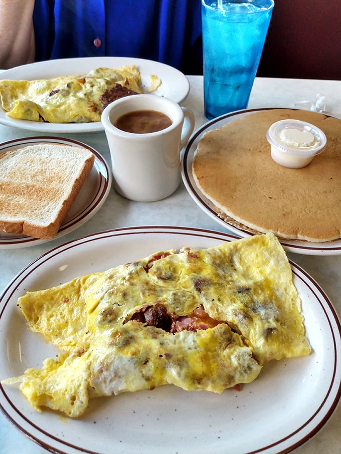 Omelets should be fluffy life rafts on a sea of breakfast possibilities. Nancy's delivers with this cheese-draped beauty alongside pancakes that could make IHOP weep.