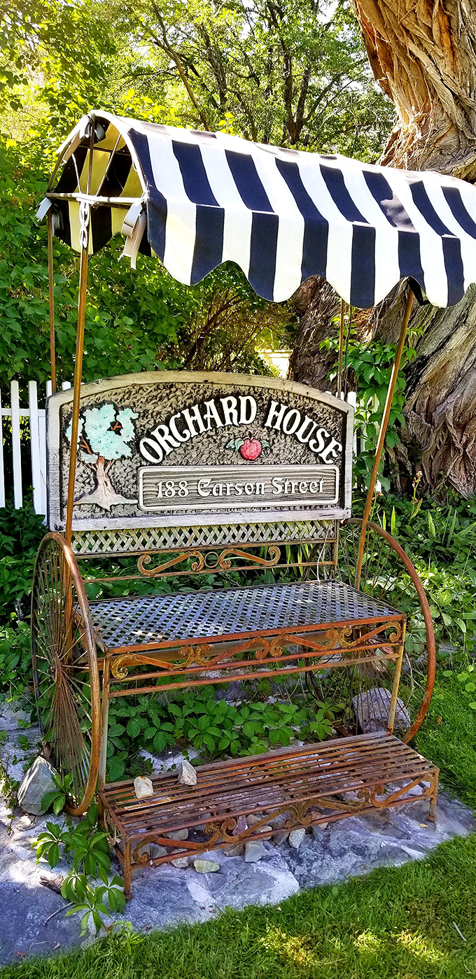 The charming Orchard House bench invites you to sit a spell &ndash; because in Genoa, "rushing" means you might miss saying hello to a neighbor.