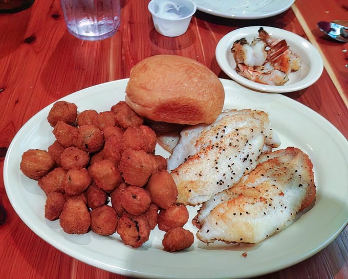 Perfectly seared fish with a golden-brown crust that shatters with each bite, paired with hush puppies that would make any Southerner proud.