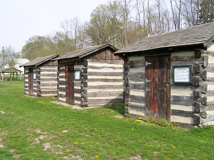 These log cabins at Paradise Spring Treaty Grounds whisper stories of America's frontier days. Simple structures that housed complicated histories.