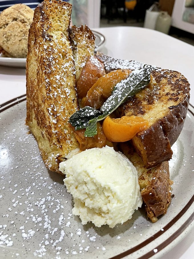 French toast that makes ordinary bread feel inadequate. Those caramelized peaches aren't just fruit&mdash;they're nature's candy having a pool party.