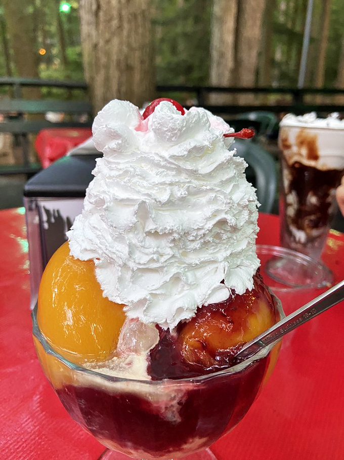 The Peach Melba arrives like summer in a glass&mdash;fresh peaches and berries crowned with a cloud of whipped cream and that essential cherry on top.