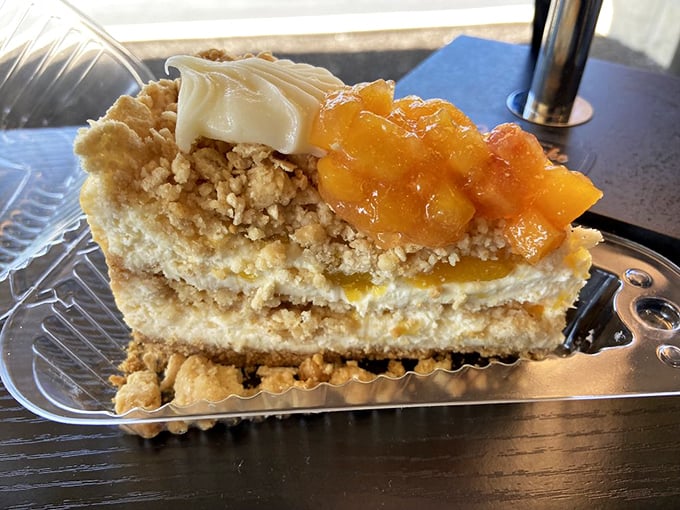 Peach cobbler meets cheesecake in a culinary blind date that turned into a beautiful marriage. That crumble topping deserves its own fan club.