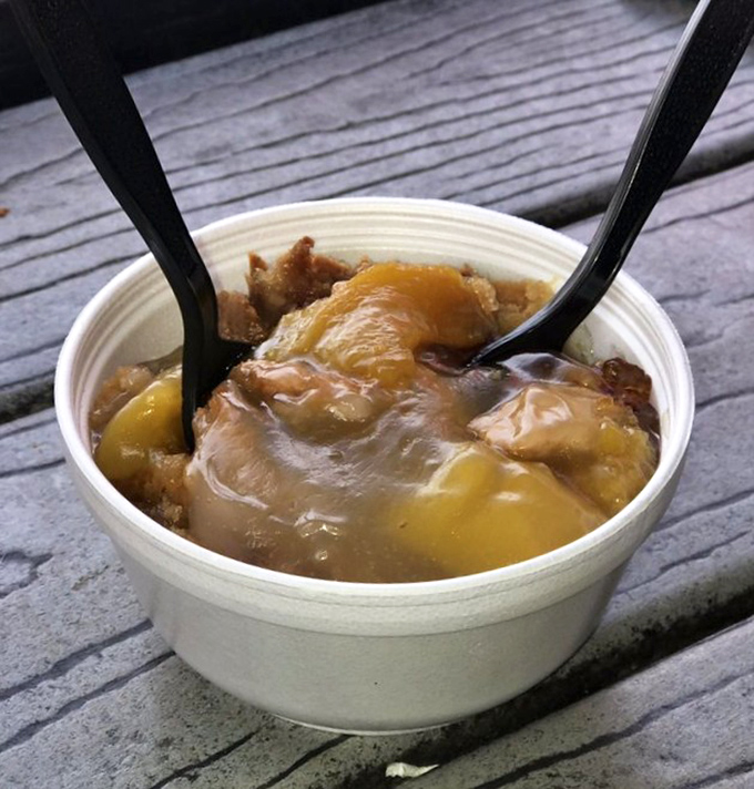 Sweet salvation after the spice storm. This peach cobbler doesn't just end your meal—it rescues your taste buds from capsaicin captivity.