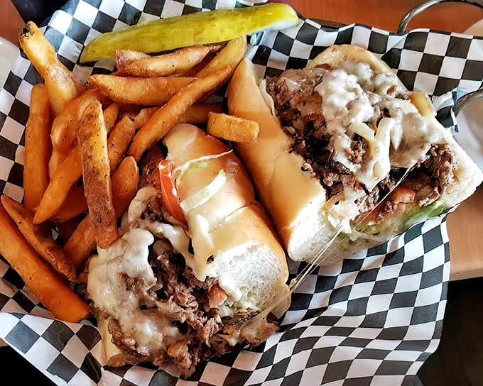 Behold the philly cheesesteak&mdash;served not on a traditional checkered paper but a proper basket that says, "Yes, this sandwich demands respect and proper cutlery."