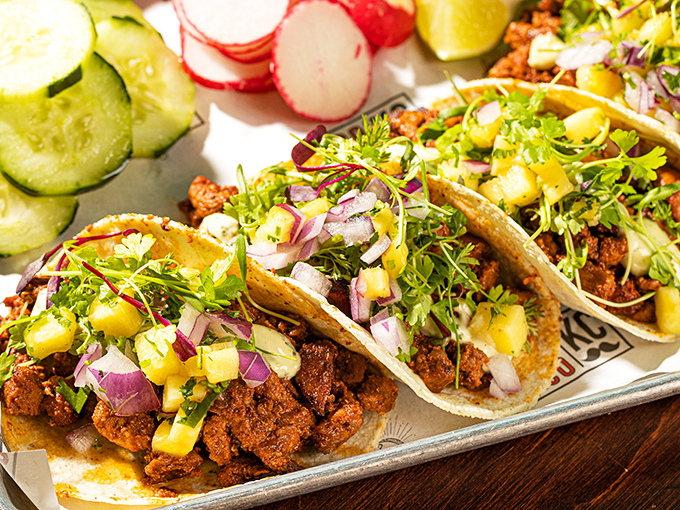 Tacos that transport you straight to Mexico City streets. The pineapple-kissed pork al pastor topped with fresh cilantro and onion is vacation in edible form.
