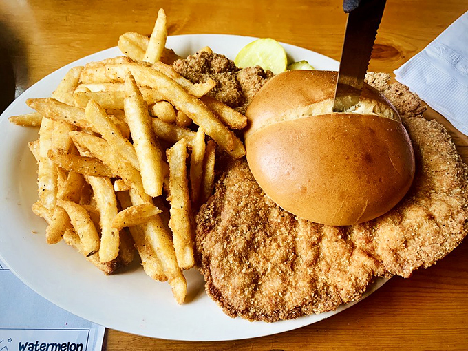 The pork tenderloin sandwich extends well beyond its bun, a Midwestern tradition that asks the important question: "Where's the bread?"