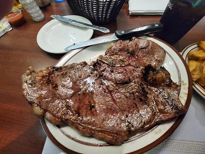 This porterhouse isn't just a steak; it's a declaration of intent. The kind of meal that makes vegetarians momentarily question their life choices.