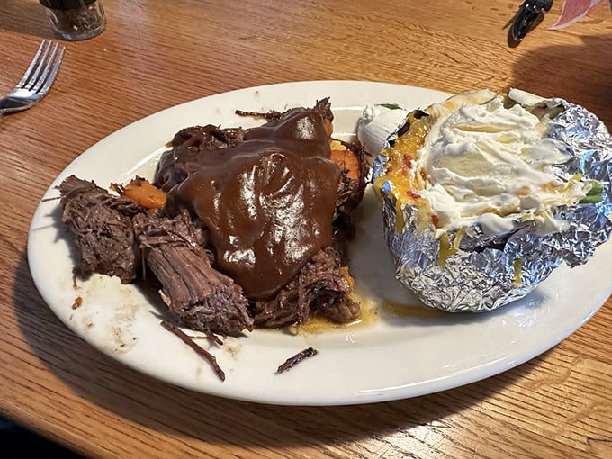 Pot roast that doesn't just fall apart&mdash;it practically surrenders to your fork, while that foil-wrapped potato waits patiently for its butter bath.