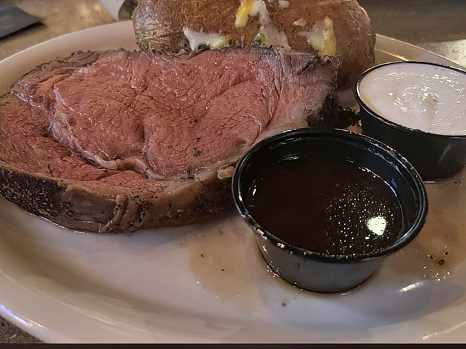 Prime rib so perfectly pink it could make a vegetarian question their life choices. That au jus is liquid gold.